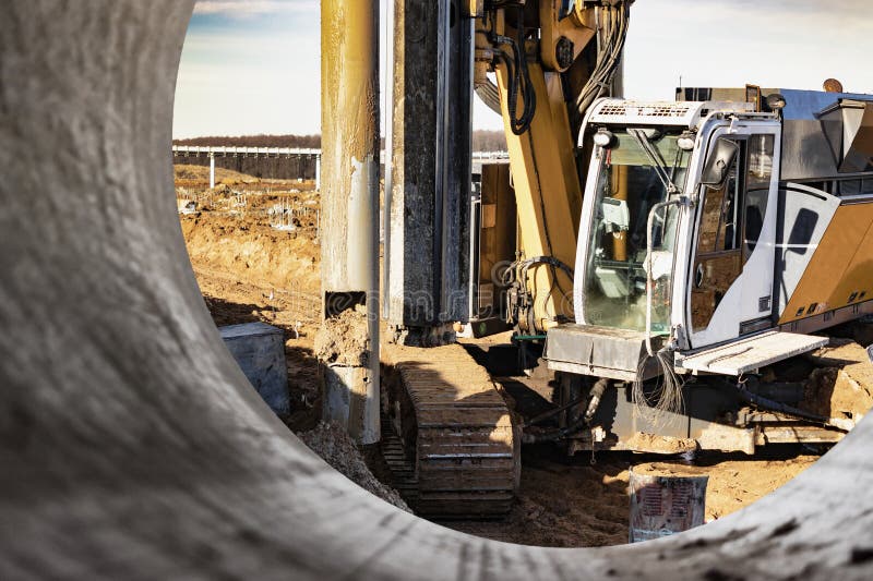 Hydraulic Drilling Machine in Excavation at the Construction Site ...
