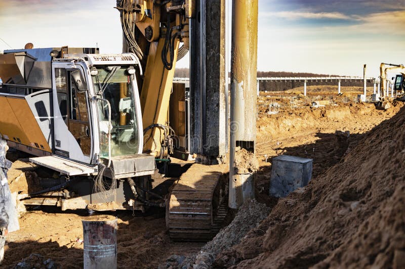 Hydraulic Drilling Machine in Excavation at the Construction Site ...