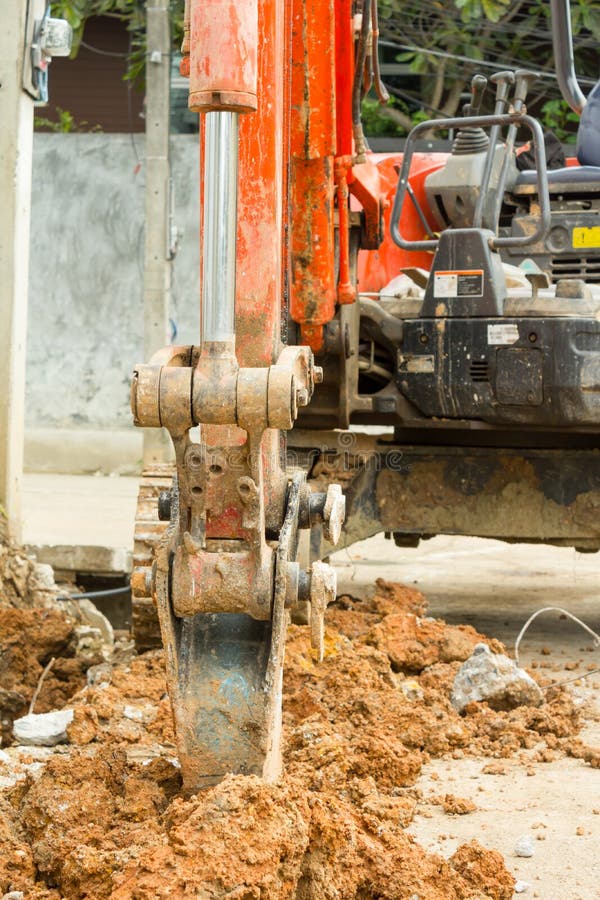 Hydraulic Hammer is Building a Drainage, Digging Road Surface Stock ...