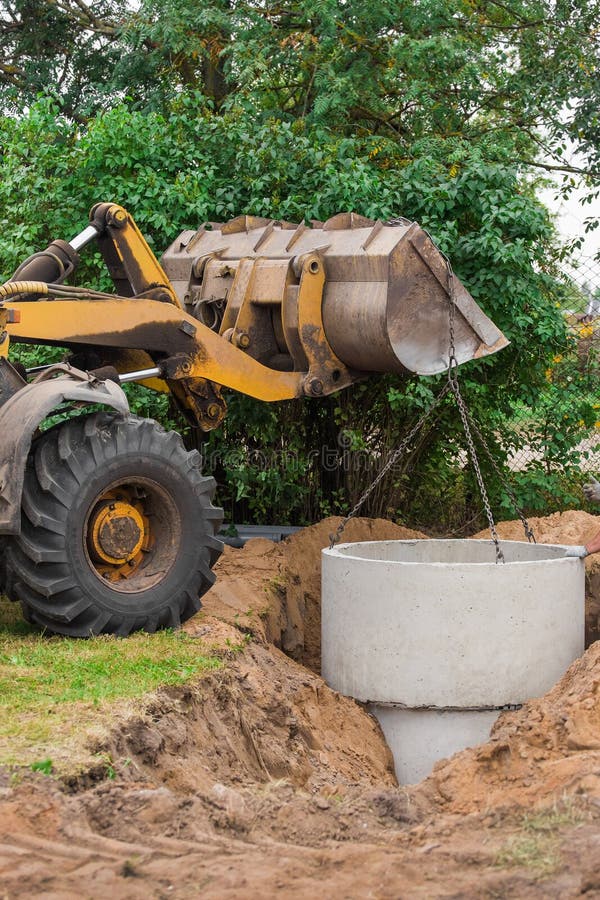 Hydraulic Piston System of the Excavator with a Bucket, Lowering into ...