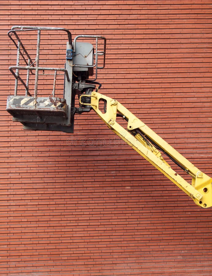 Hydraulic Work Platform Against Wall Stock Photo - Image of access ...