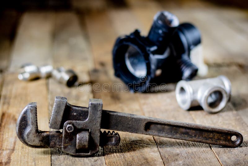 Hydraulics, Tools for Plumber on Wooden Table. Workshop, Table a Stock ...