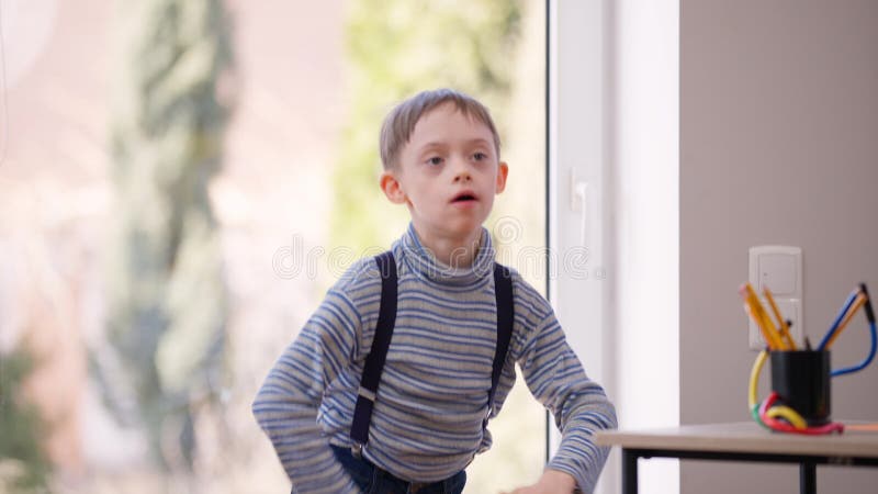 Hyperactive Autistic Boy Jumping Gesturing Indoors Laughing Having Fun ...