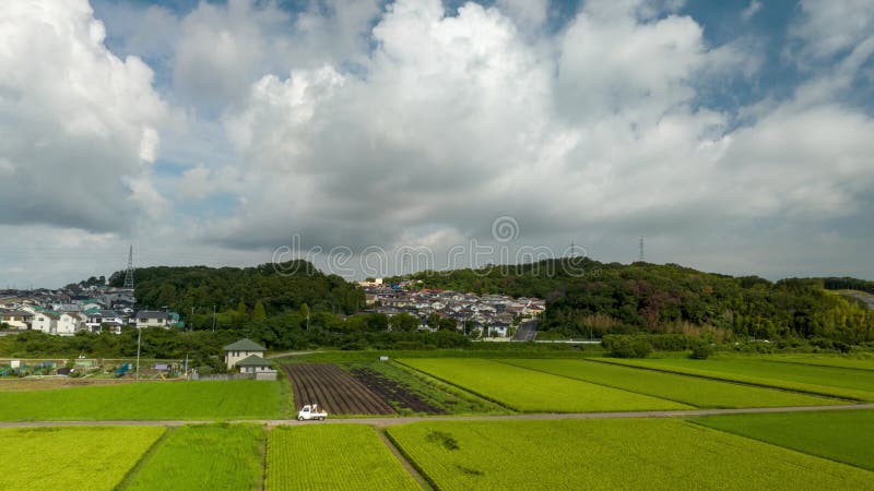Hyperlapse: Clouds Move Over Rice Fields and Small Hillside ...