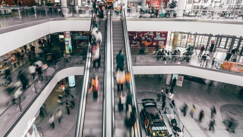 Hyperlapse Footage of a Crowd of People Using Escalators and Walking ...