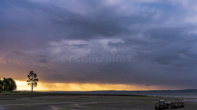 Hyperlapse Footage of the Dense Clouds Moving in the Dusk Sky Over the River Bank at Sunset ...