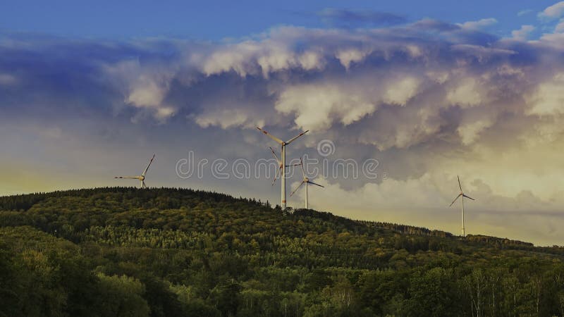 Hyperlapse Footage of the Wind Turbines Working Under a Cloudy Dusk Sky ...