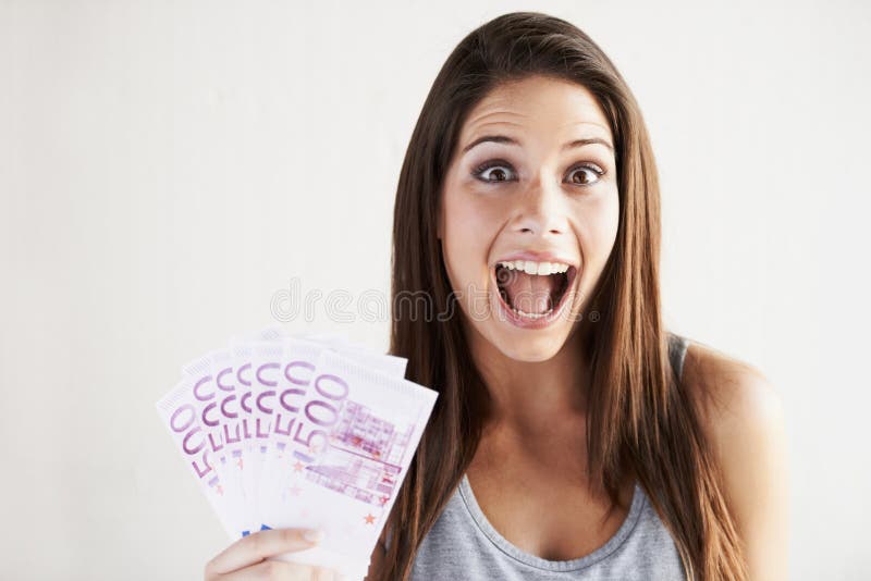 I Cant Believe I Won. Portrait of a Young Woman Holding a Fanned-out ... I Cant Believe I Won. Portrait of a Young Woman Holding a Fanned-out ...