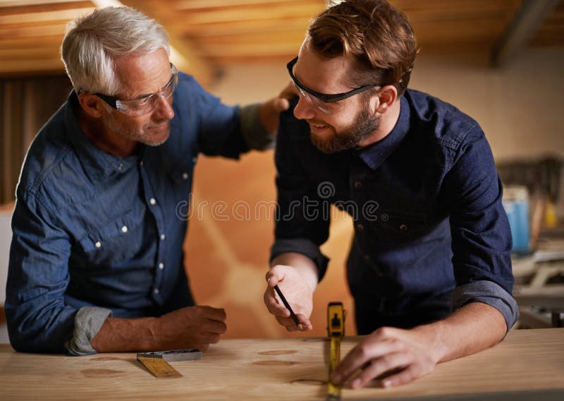 Am I Doing this Right. a Father and Son Working Together in a Workshop ...