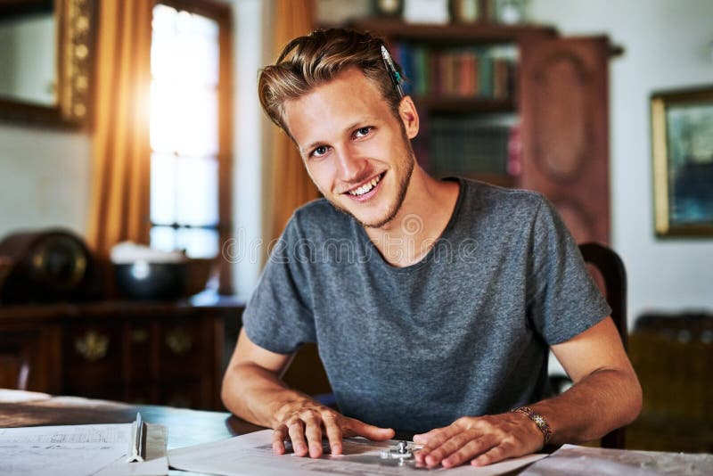 I Enjoy Drafting by Hand. a Young Man Working on a Project at Home ...