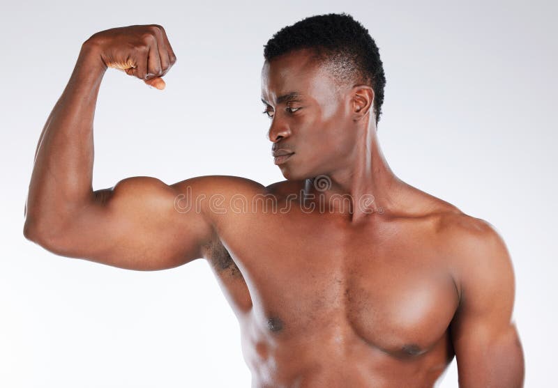 I Flex for an Ego Boost. a Handsome Young Man Flexing His Bicep while ...