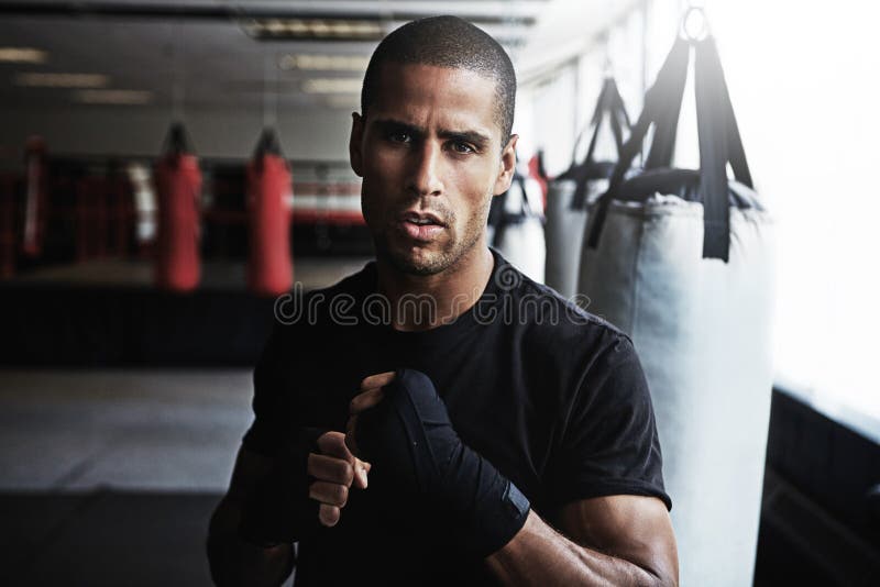 I Get Stronger Each Day. a Kick-boxer Training in a Gym. Stock Image ...