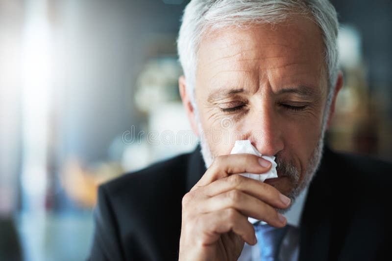 I Hate Being Sick. a Frustrated Businessman Using a Tissue To Sneeze in ...