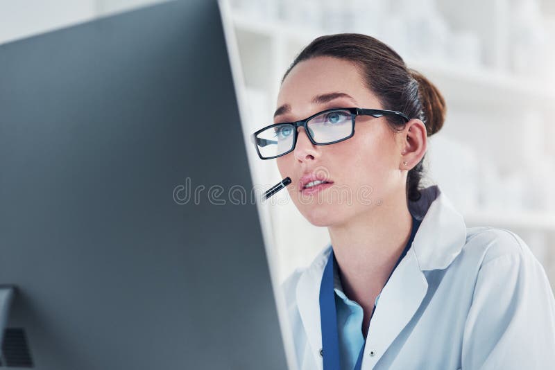 I Have To Study this Case. a Focused Young Female Scientist Working on ...