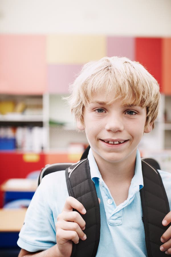 I Learn New Things Every Day. a Young Boy Holding the Straps of His ... I Learn New Things Every Day. a Young Boy Holding the Straps of His ...