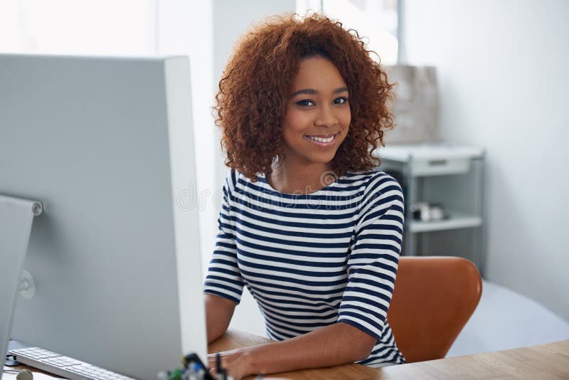 I Love My Job. a Young Woman at Work on a Computer in an Office. Stock ...