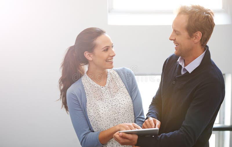 I Love this. Two Colleagues Looking at a Tablet. Stock Photo - Image of ...