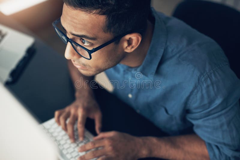 I Might Bend a Little but I Dont Fold. a Young Using a Computer in a ...