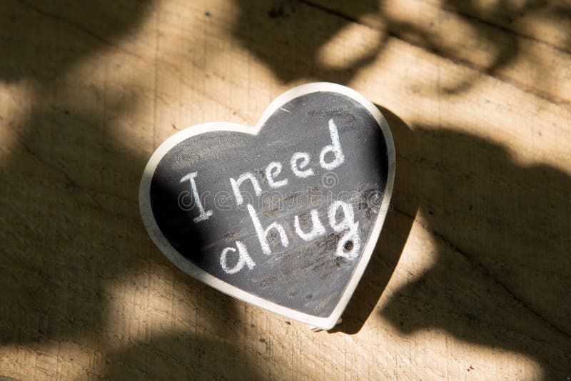 I Need a Hug Hand Drawing Phrase on a Heart, Sharing a Hug Concept ...