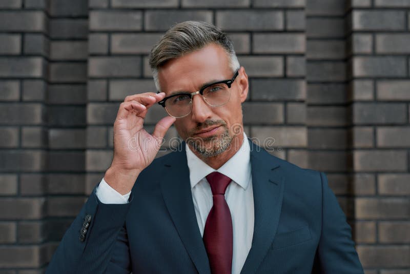 I See You Clearly Handsome Mature Businessman Adjusting His Eyeglasses