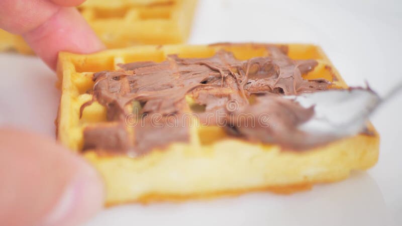 I Spread Chocolate on a Wiener Waffle with a Spoon while the Camera ...