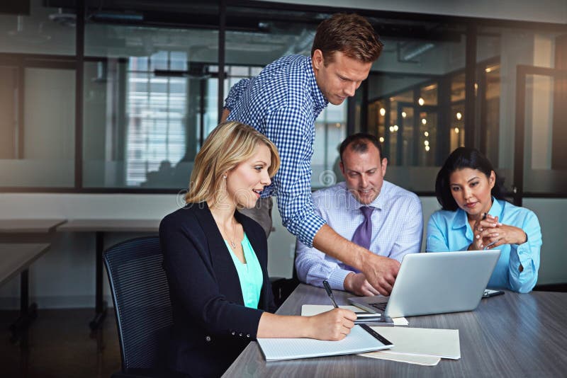 I Think this Needs More Reviewing. a Group of Colleagues Using a Laptop ...