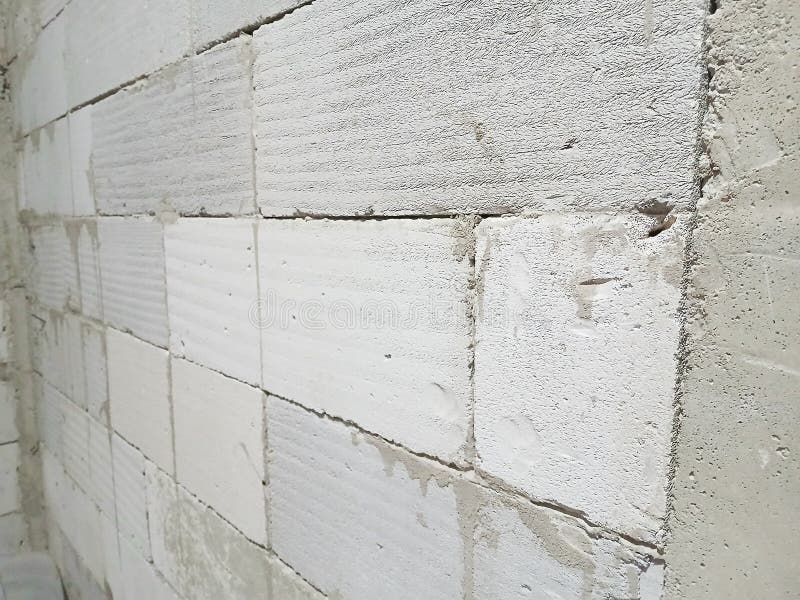 The I a Wall Made of White Concrete Bricks Arranged in a Rectangular ...