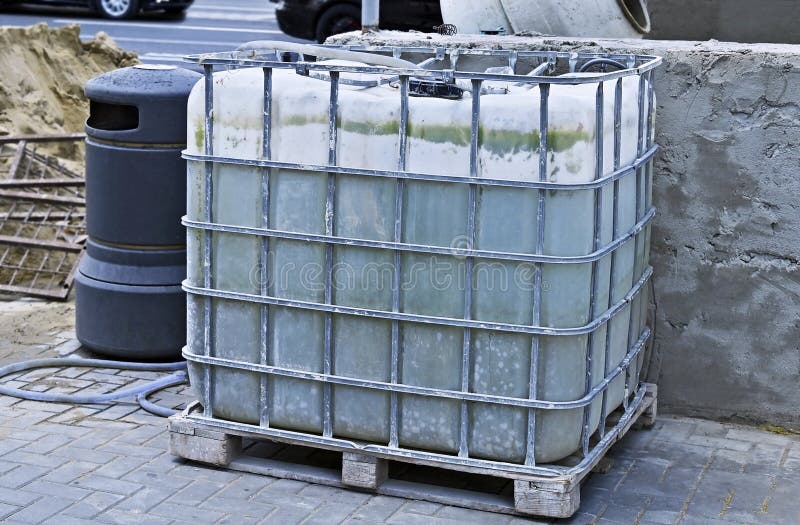 IBC container for liquid stock image. Image of canal - 318806469