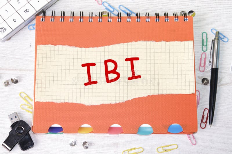 IBI Word is Written on a Sheet in a Cage Lying on a Notebook on the ...