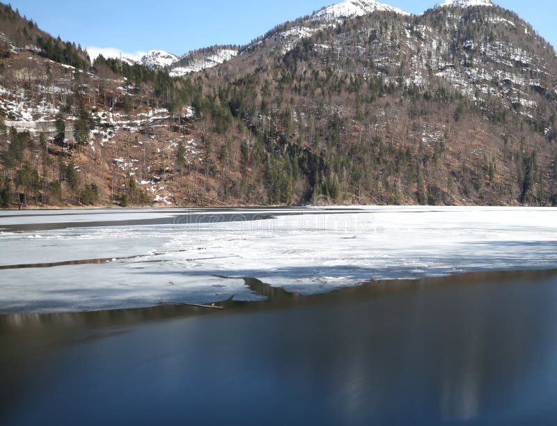 Ice on the alpine lake stock image. Image of mount, long - 117669583