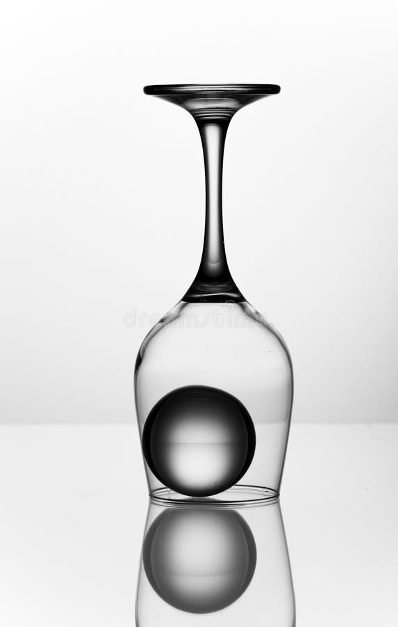 Ice Ball Inside a Wine Glass with Reflection Stock Photo - Image of ...