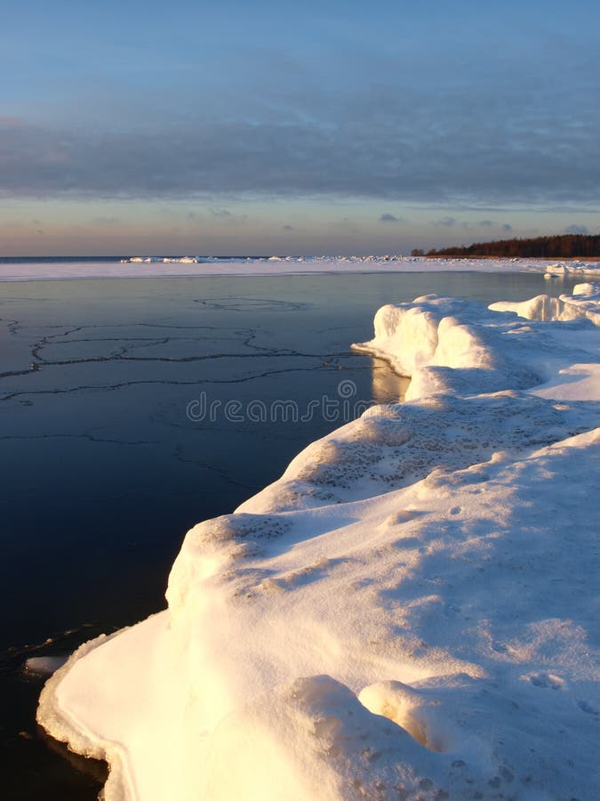 Ice banks on the sea shore stock photo. Image of northern - 14355146