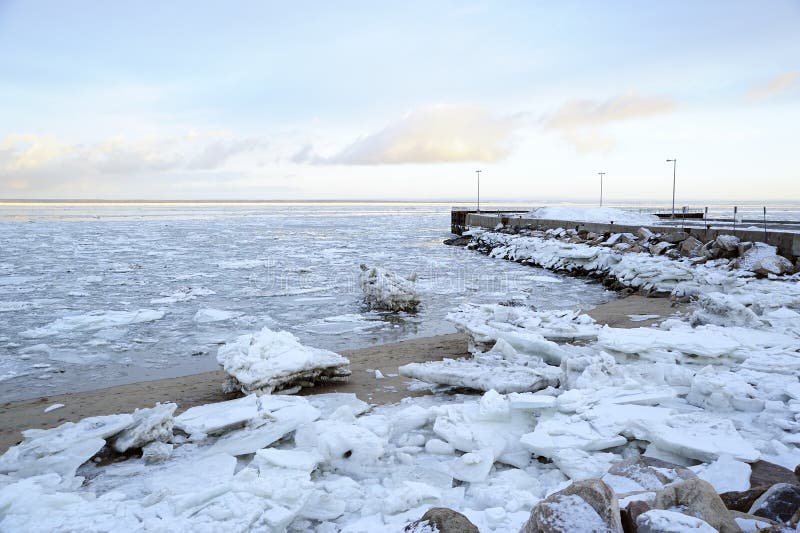 Ice on the beach and quay stock photo. Image of nature - 12738768
