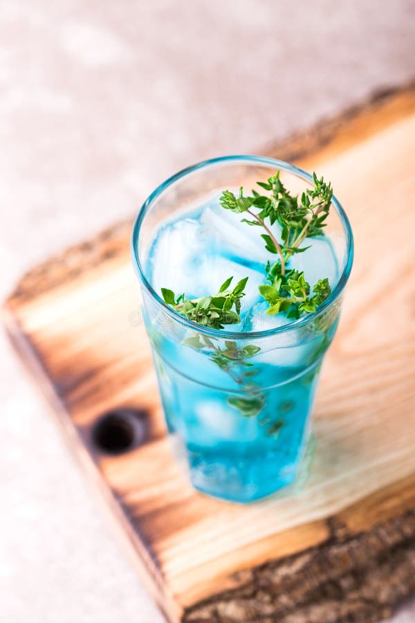 Ice Blue Cocktail with Thyme. Blue Curacao Liqueur Stock Photo - Image ...