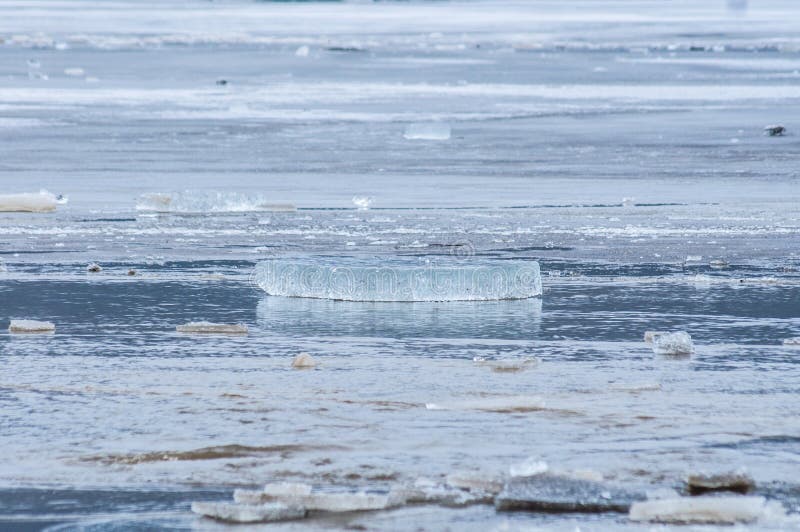 Ice breaking on the lake stock photo. Image of winter - 136957850