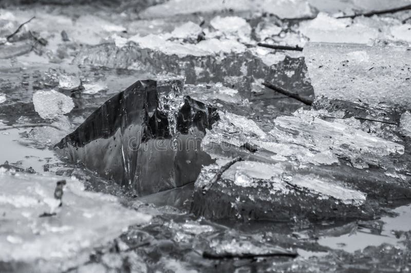 Ice breaking on the lake stock photo. Image of chilled - 136957938