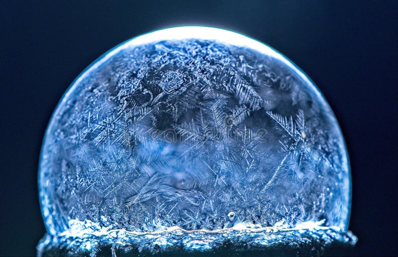 Ice Bubble with Crystals Forming with Blue Light Stock Image - Image of ...