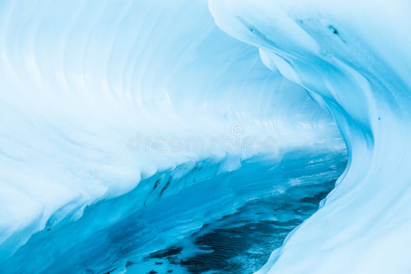 Ice Canyon through a Glacier in Remote Alaska. Melting Glacier River ...