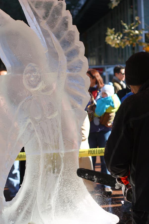 Ice Carving artist at work editorial stock photo. Image of melting ...