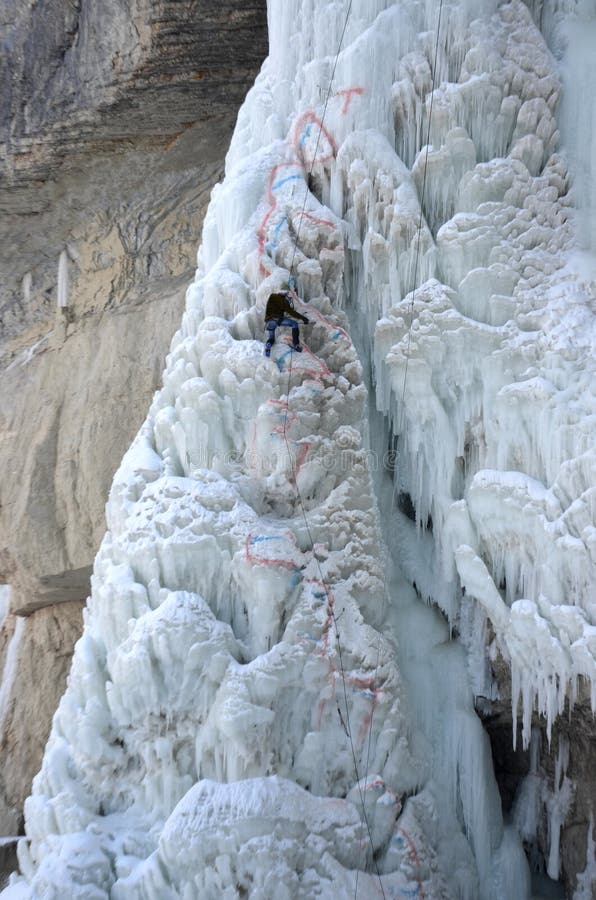 Ice Climbing Competition. Climbers Climb an Ice Cliff Stock Image ...