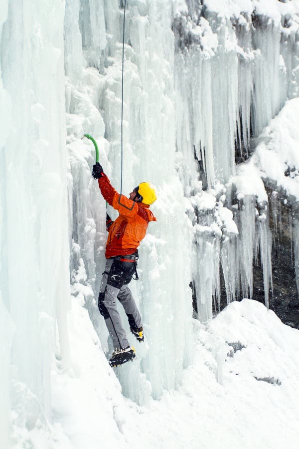 Ice Climbing.Man Climbing Frozen Waterfall. Stock Image - Image of ...