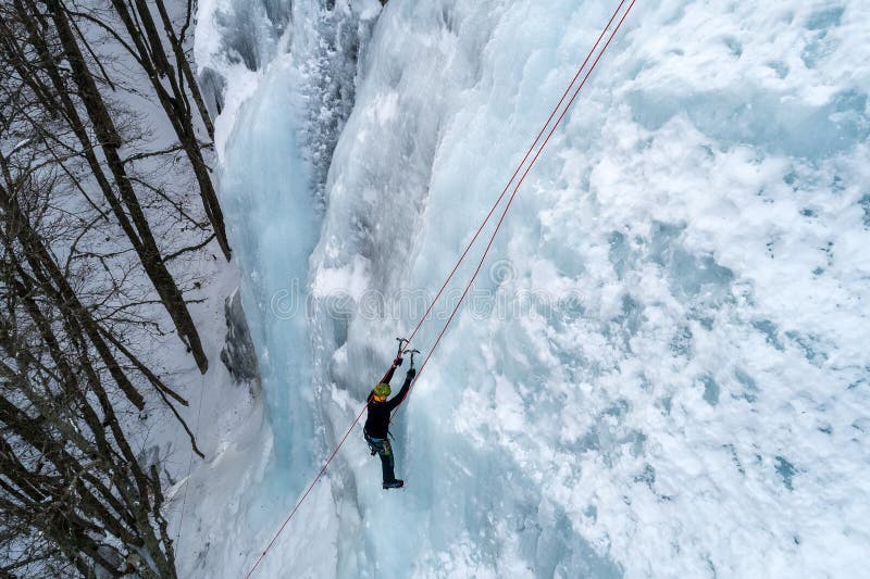 Ice Climbing the North Greece, Man Climbing Frozen Waterfall Stock ...
