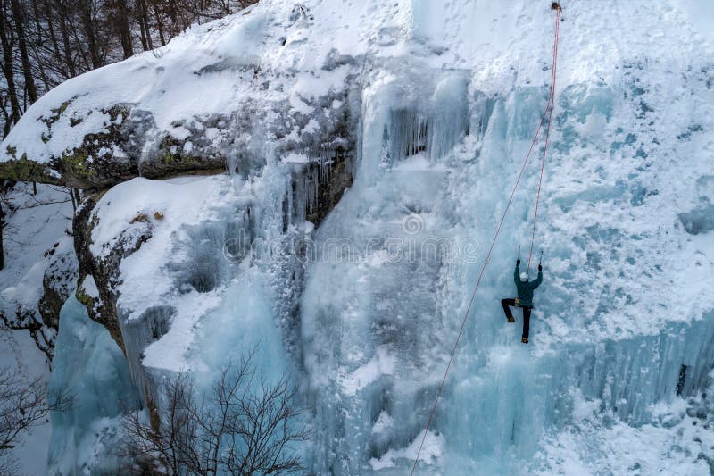 Ice Climbing the North Greece, Man Climbing Frozen Waterfall Stock ...