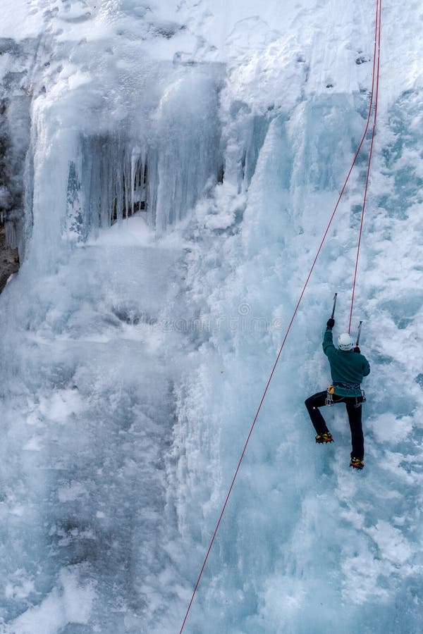 Ice Climbing the North Greece, Man Climbing Frozen Waterfall Stock ...