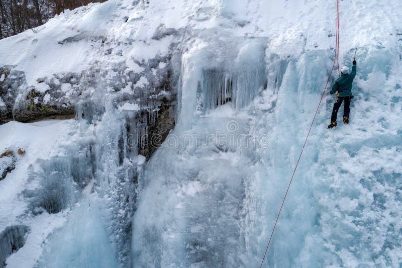 Ice Climbing the North Greece, Man Climbing Frozen Waterfall Editorial ...