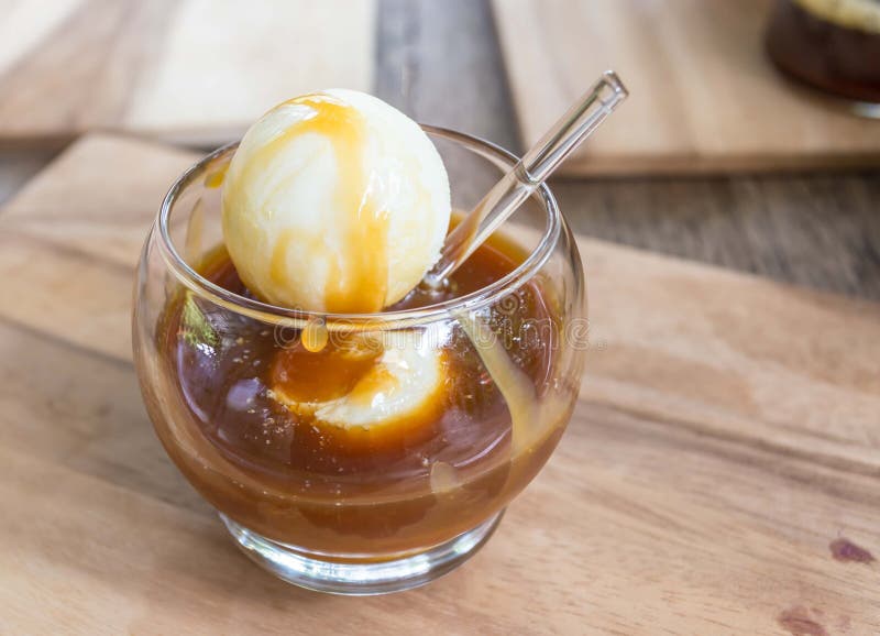 Ice Coffee with Ice Cream Pour with Caramel Sauce Stock Photo - Image ...