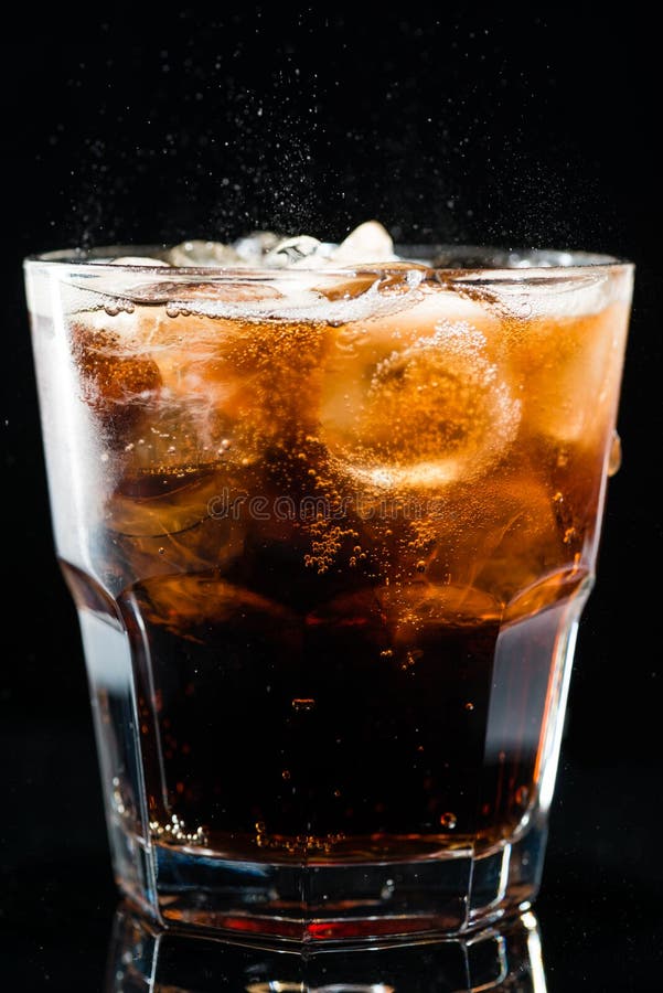 Ice Cola with Splashing CO Bubbles in a Glass Stock Image - Image of ...