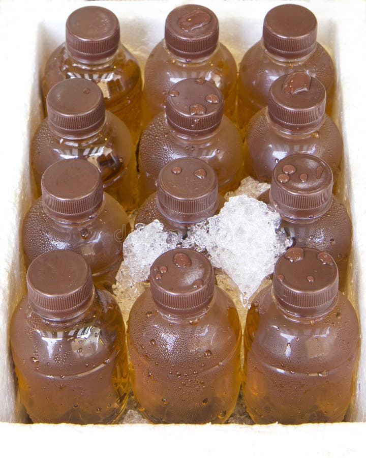 Ice Cold Juice in bottles stock image. Image of condensation - 34065593