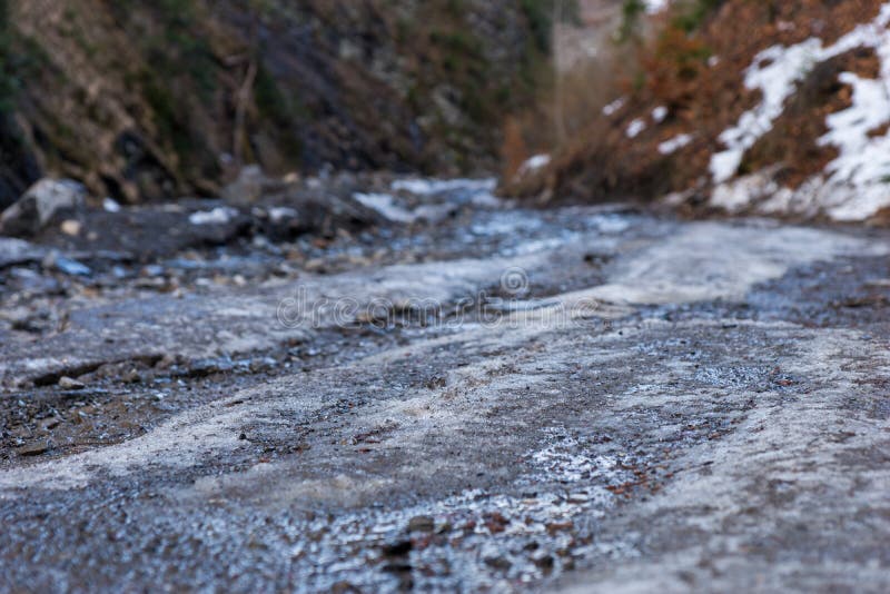Ice-covered and Covered with Mud Road in the Forest Stock Photo - Image ...