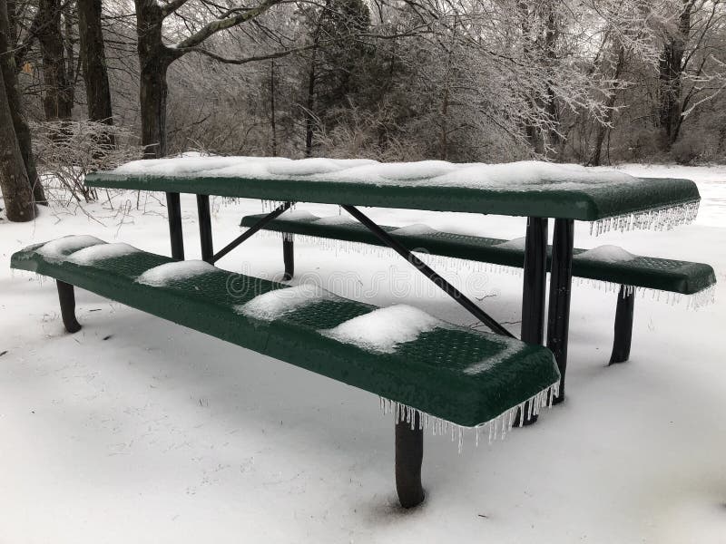 Ice covered picnic table stock image. Image of season - 137553185